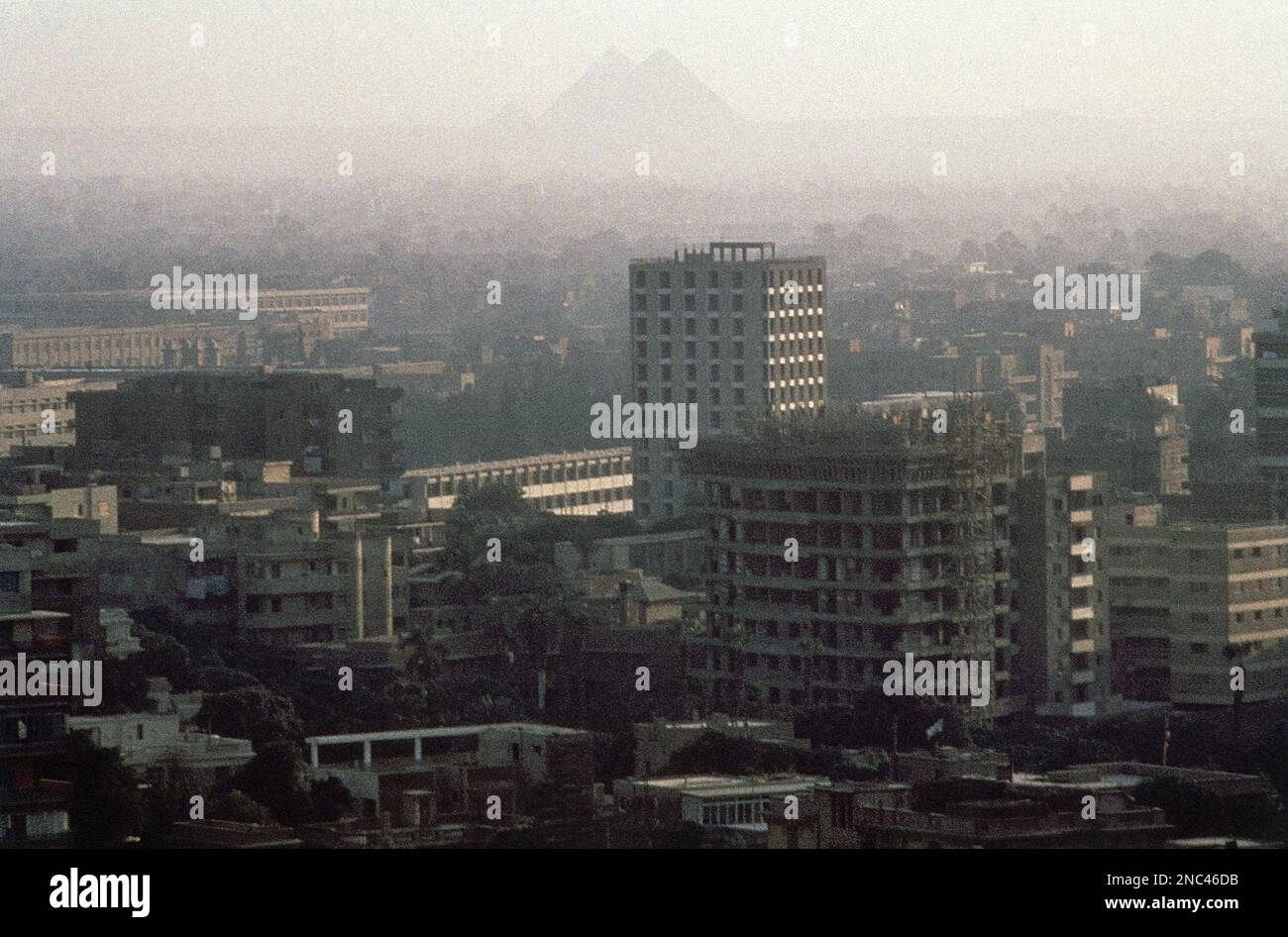 View of the skyline with Pyramids shown through a hazy atmosphere in ...