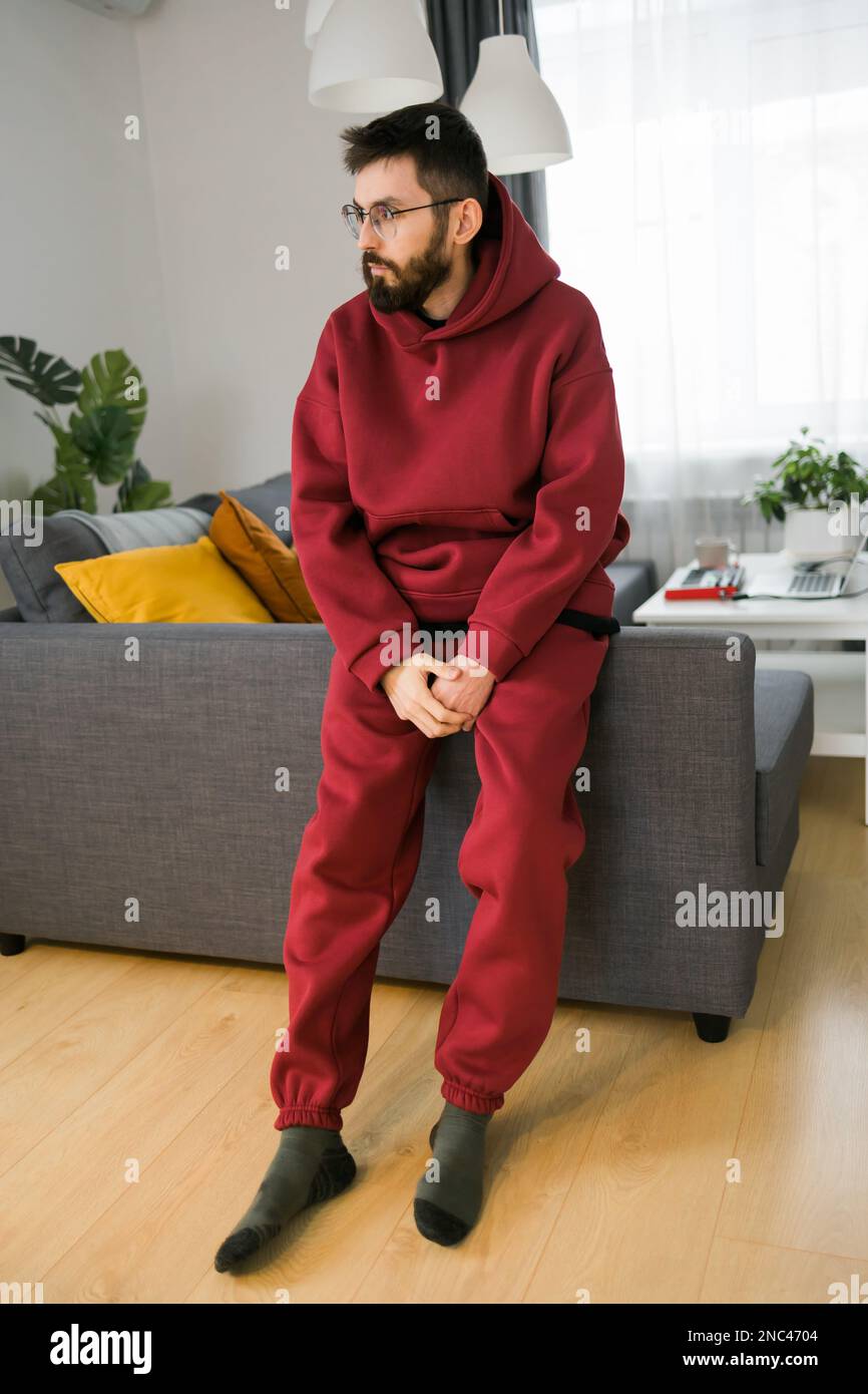 Sad man pondering about his life after a relationship breakup or ...