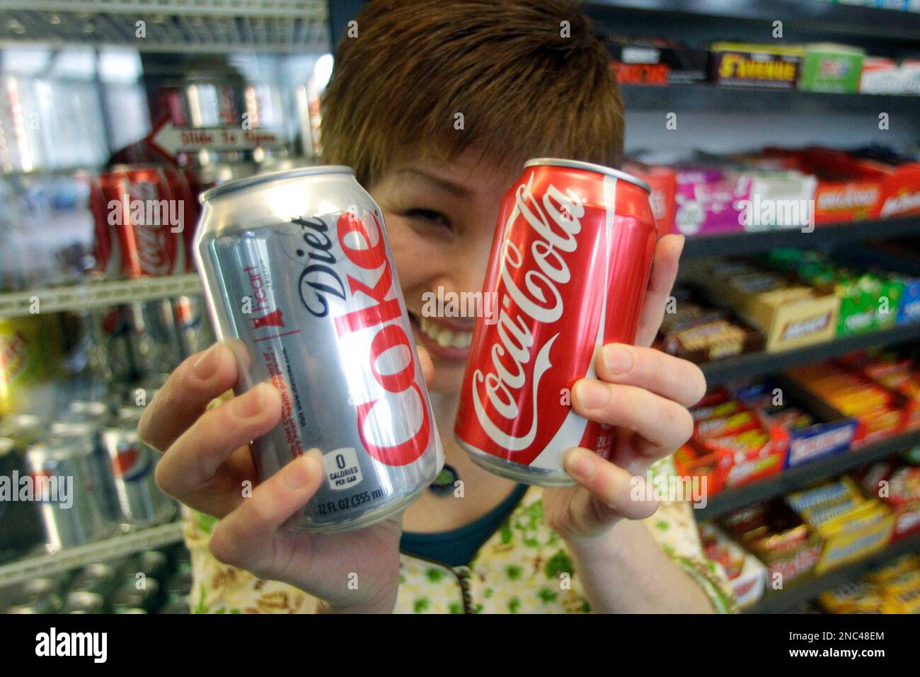 Jane Choi holds cans of Coca-Cola and Diet Coke in Anne's Deli Thursday ...