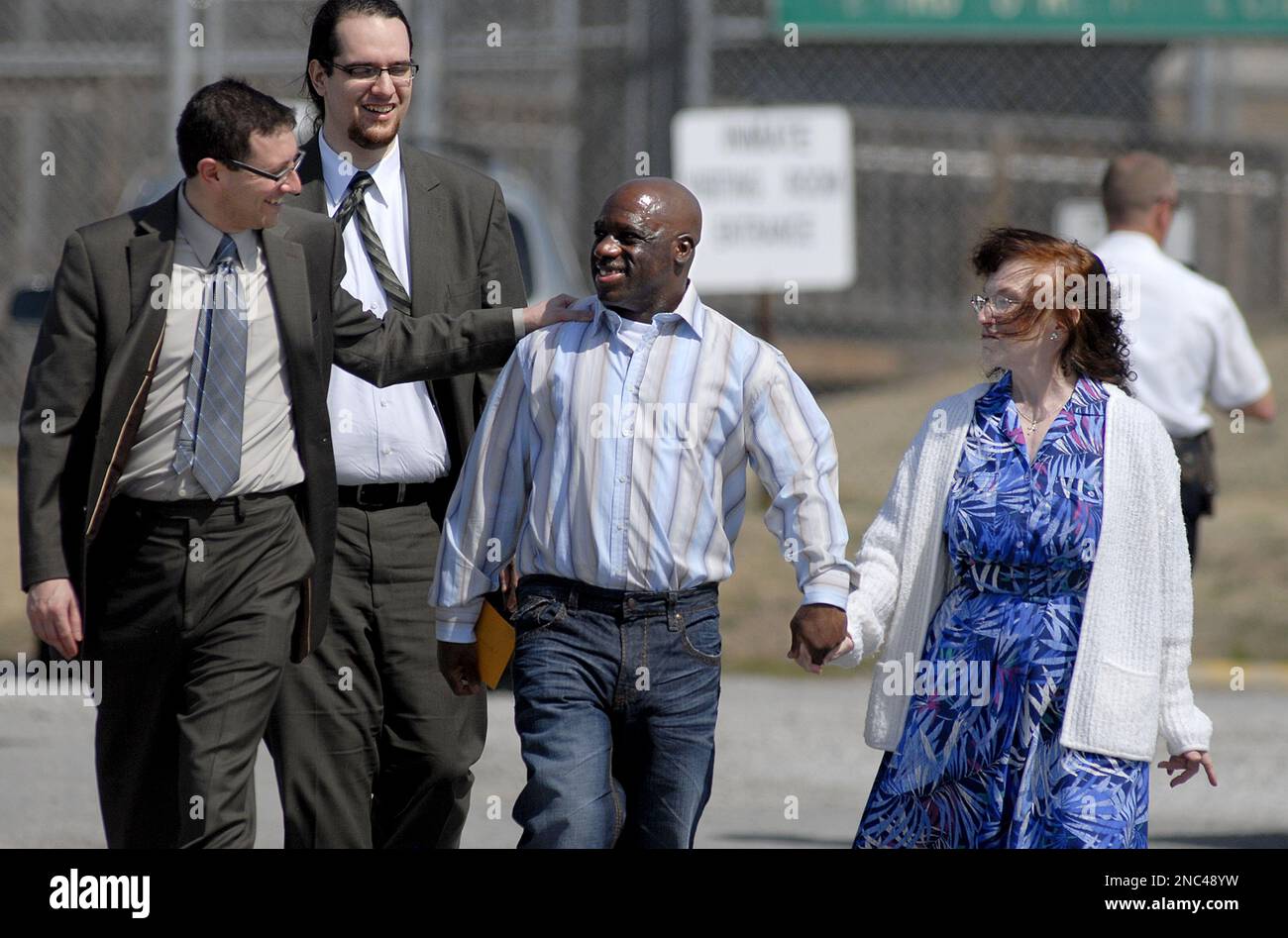 Eric Caine, center, talks with his attorney Russell Ainsworth left, of ...