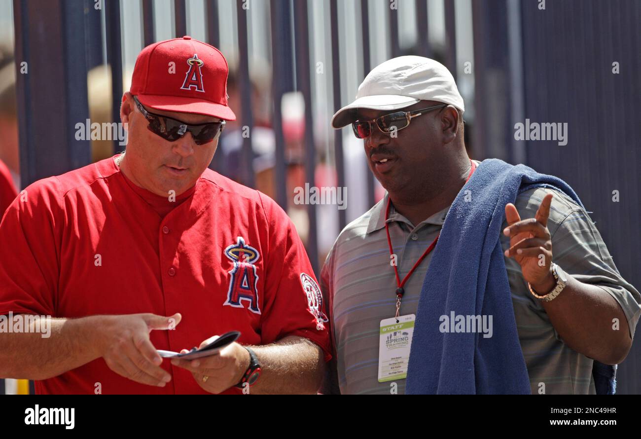 Los Angeles Angels manager Mike Scioscia and San Diego scout Chris ...
