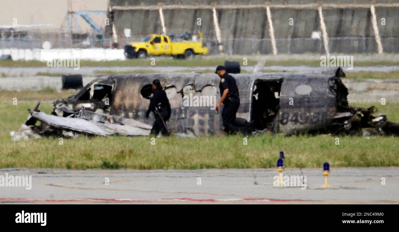 The wreckage of a twin-engine Beechcraft King Air airplane is seen ...