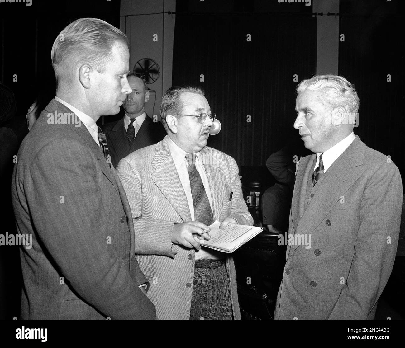 Gene Handsaker, left, and Howard Heyn, center, ask a few questions of ...