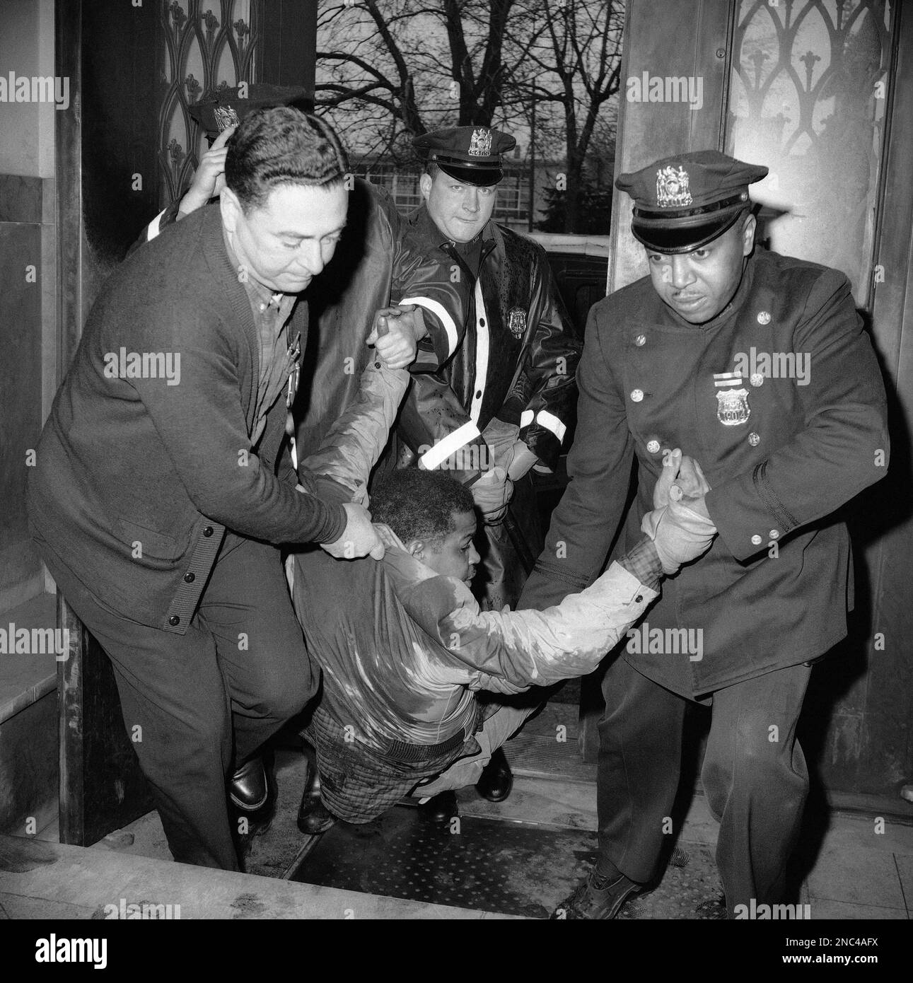 Police drag in a bloodied marcher who accompanyied the Rev. Martin ...