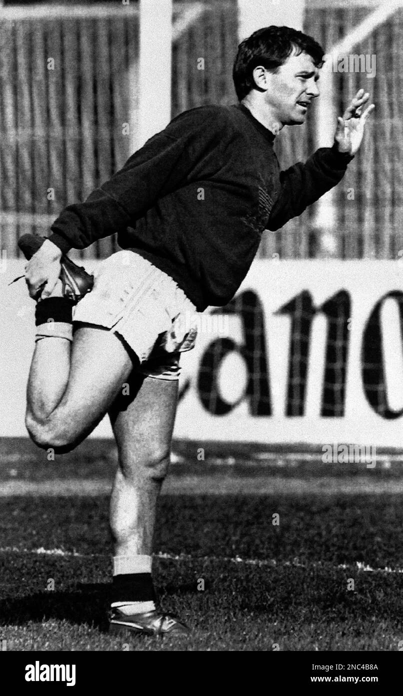 Manchester United footballer Bryan Robson stretches during a training ...