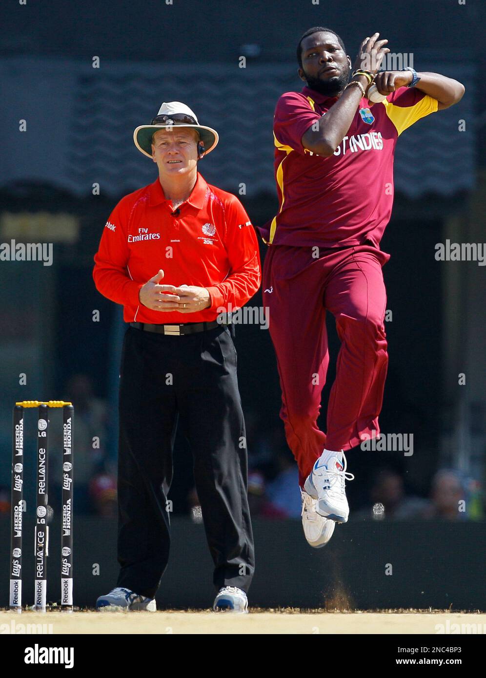 West Indies' Sulieman Benn, right, bowls during the Cricket World Cup ...
