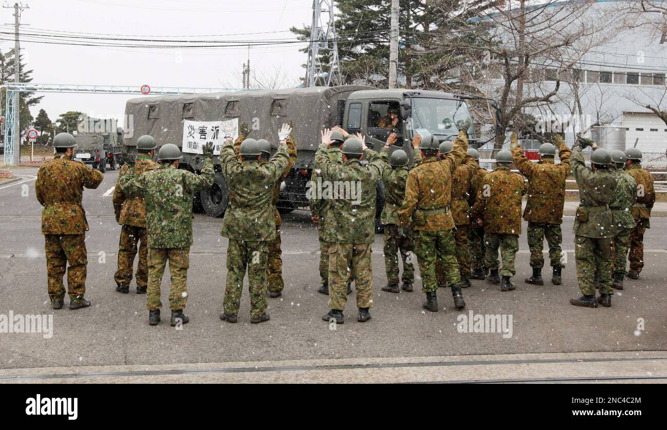 Japan Ground Self Defense Force personnel wave farewell to colleagues ...