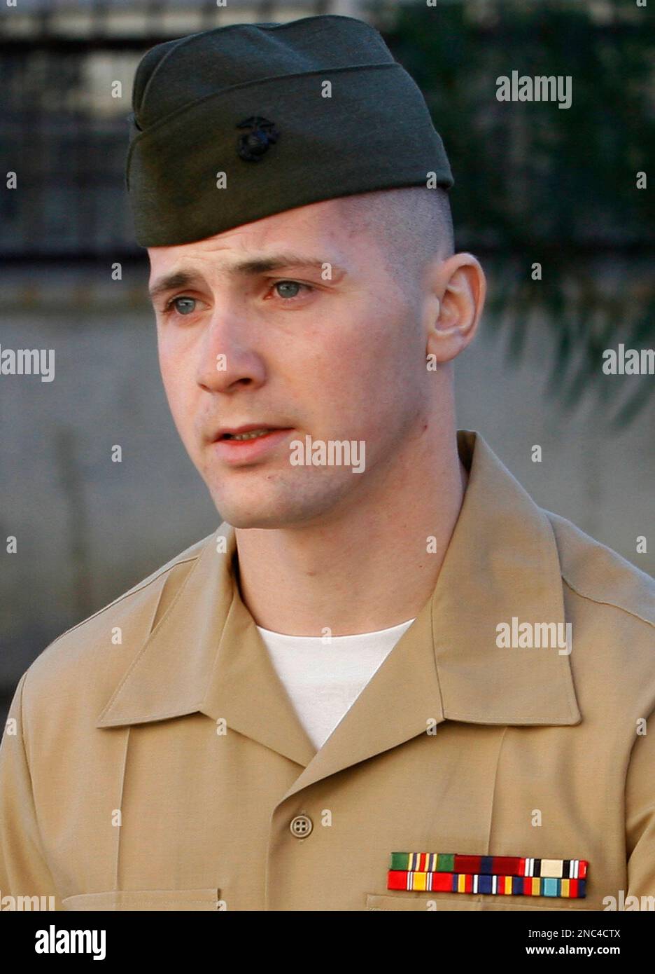 FILE - Marine Corps Sgt. Lawrence Hutchins, of Plymouth, Mass., is ...