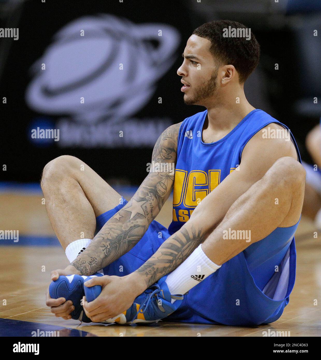 UCLA forward Tyler Honeycutt stretches during practice Wednesday, March ...