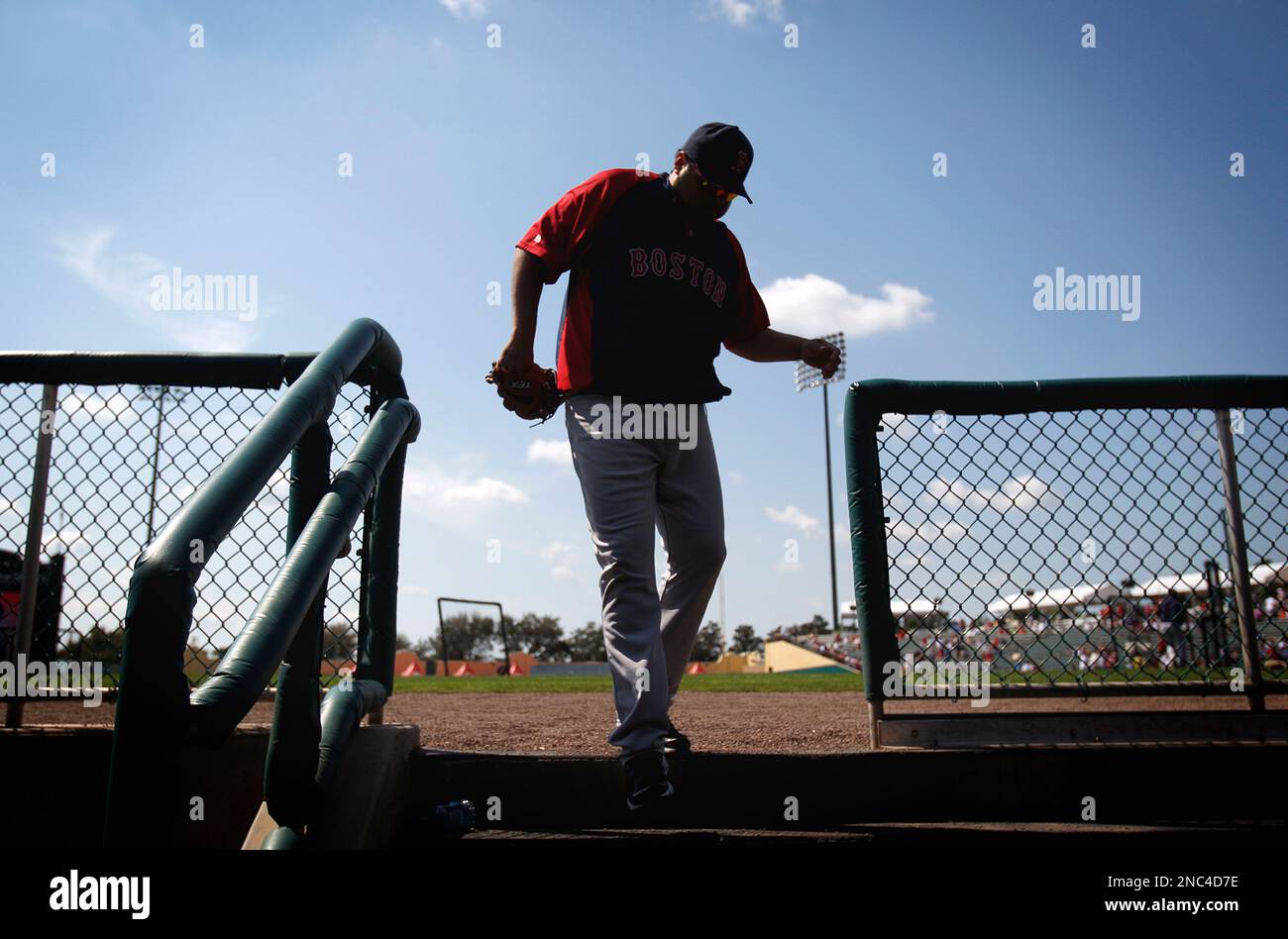 Boston Red Sox pitcher Dennys Reyes enters the dugout before a spring ...
