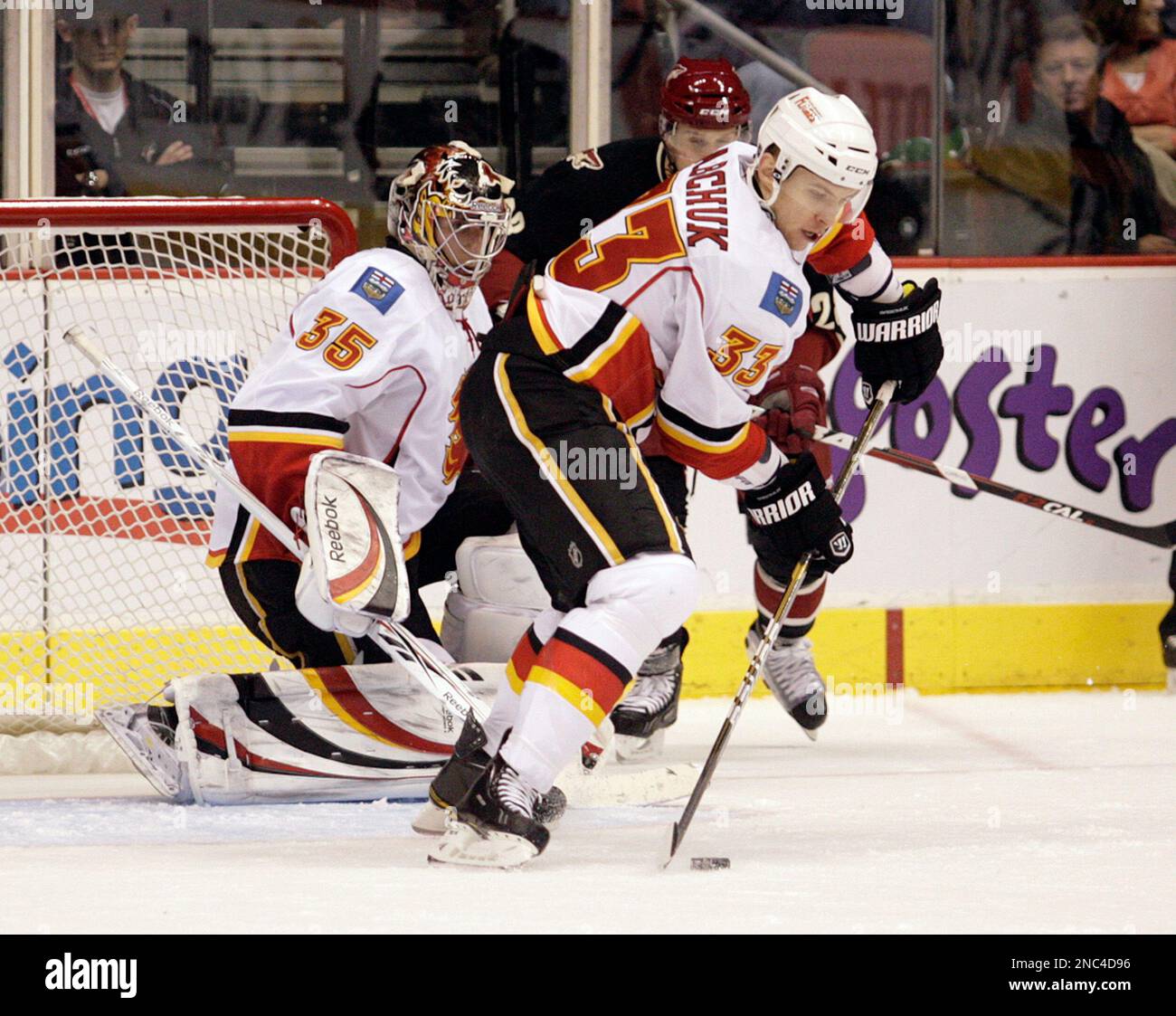 Calgary Flames' Anton Babchuk (33), of Ukraine, and goalie Henrik ...
