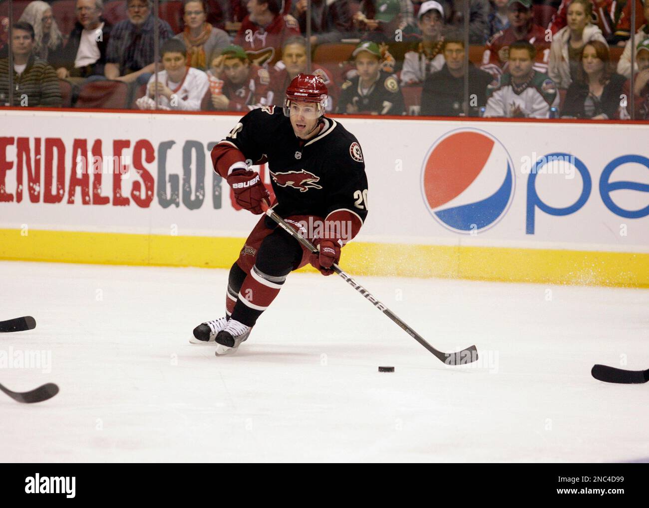 Phoenix Coyotes' Eric Belanger against the Calgary Flames in an NHL ...