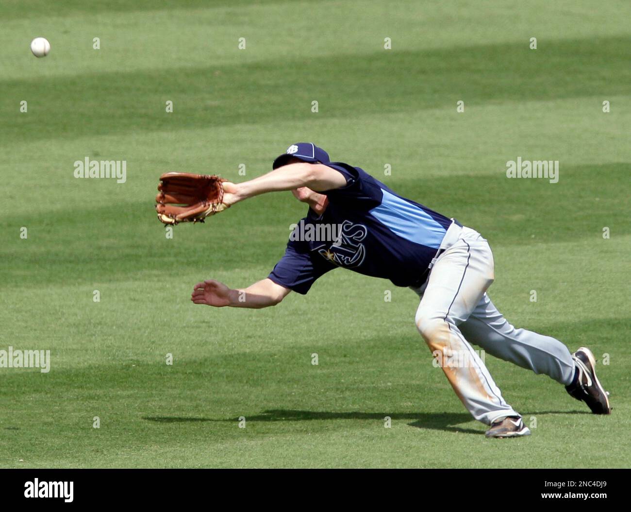 Tampa Bay Rays outfielder Sam Fuld makes a diving catch for an out off ...