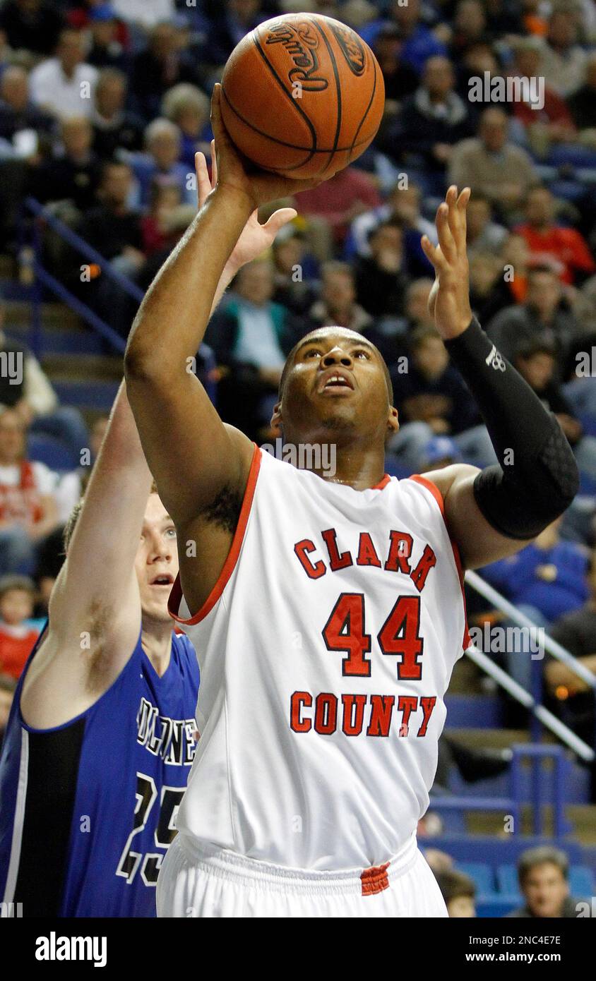 Clark County's Corey Rogers, right, shoots in front of Oldham County's ...