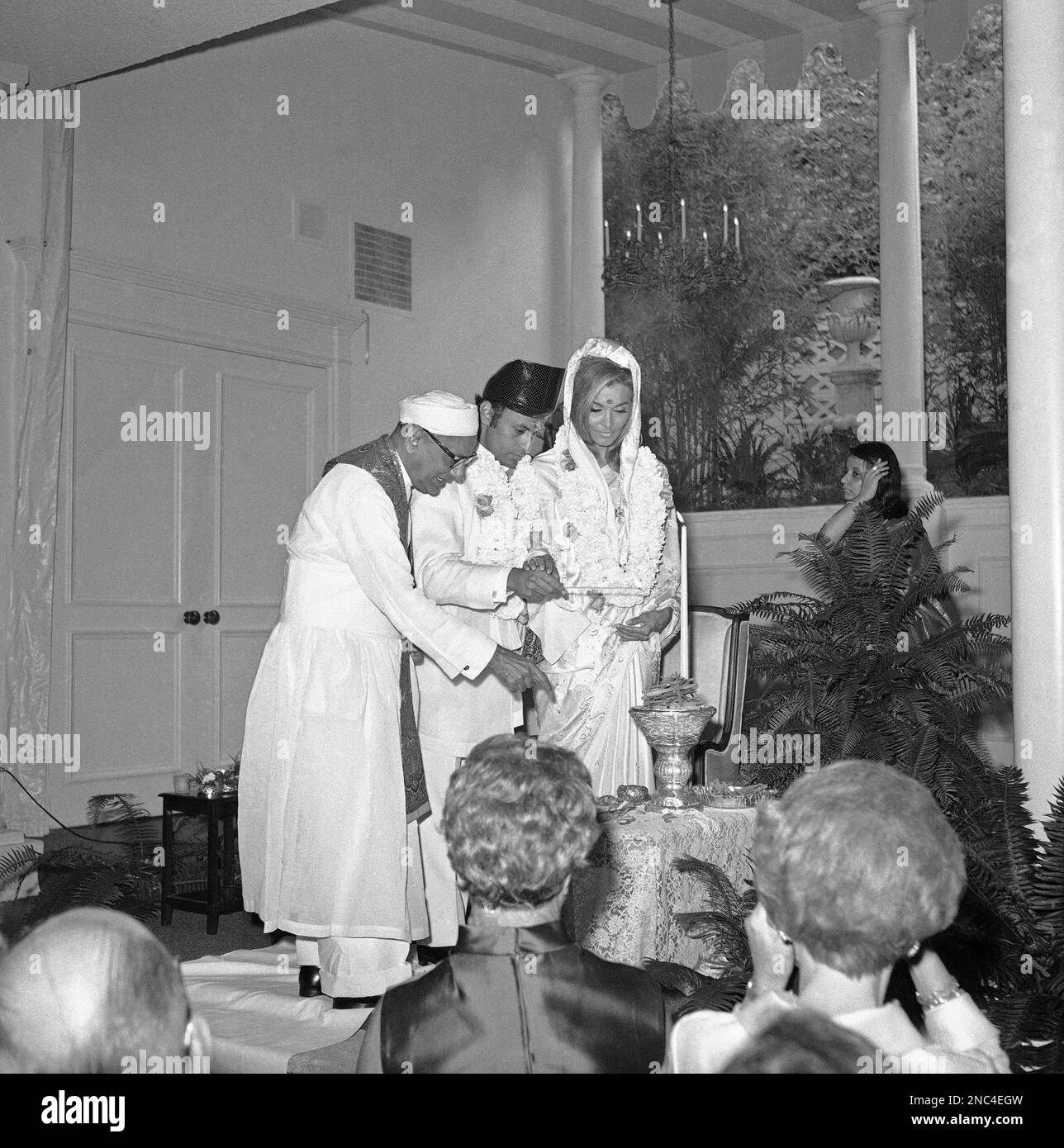 Zubin Mehta and his bride Nancy Diane Kovack prepare to light an oil ...