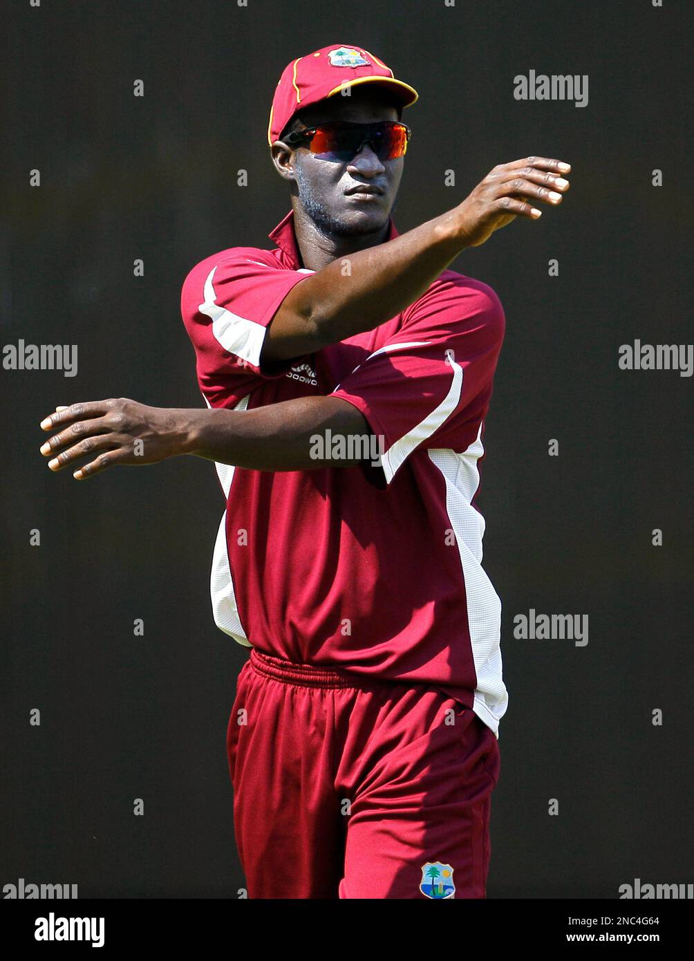 West Indie's captain Darren Sammy stretches during a team training ...