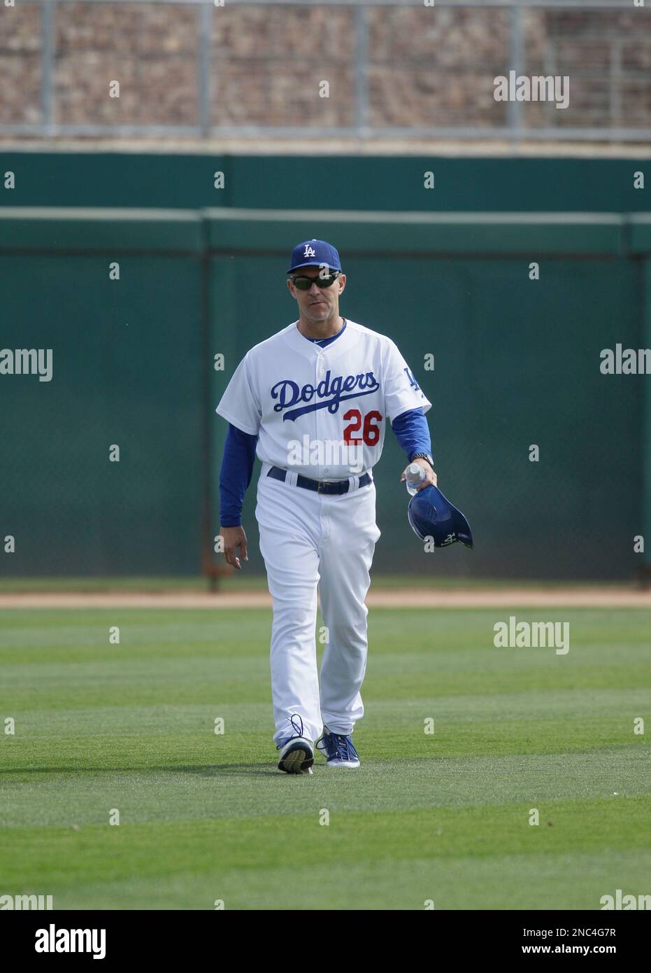 Los Angeles Dodgers third base coach Tim Wallach walks on the field ...