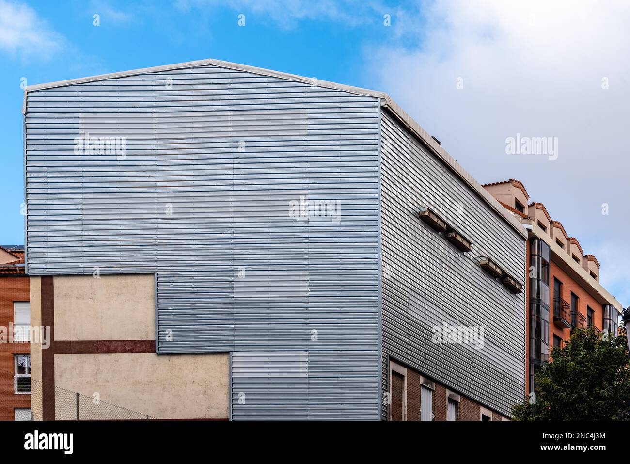 The closed steel facade of a building during restoration works after a ...