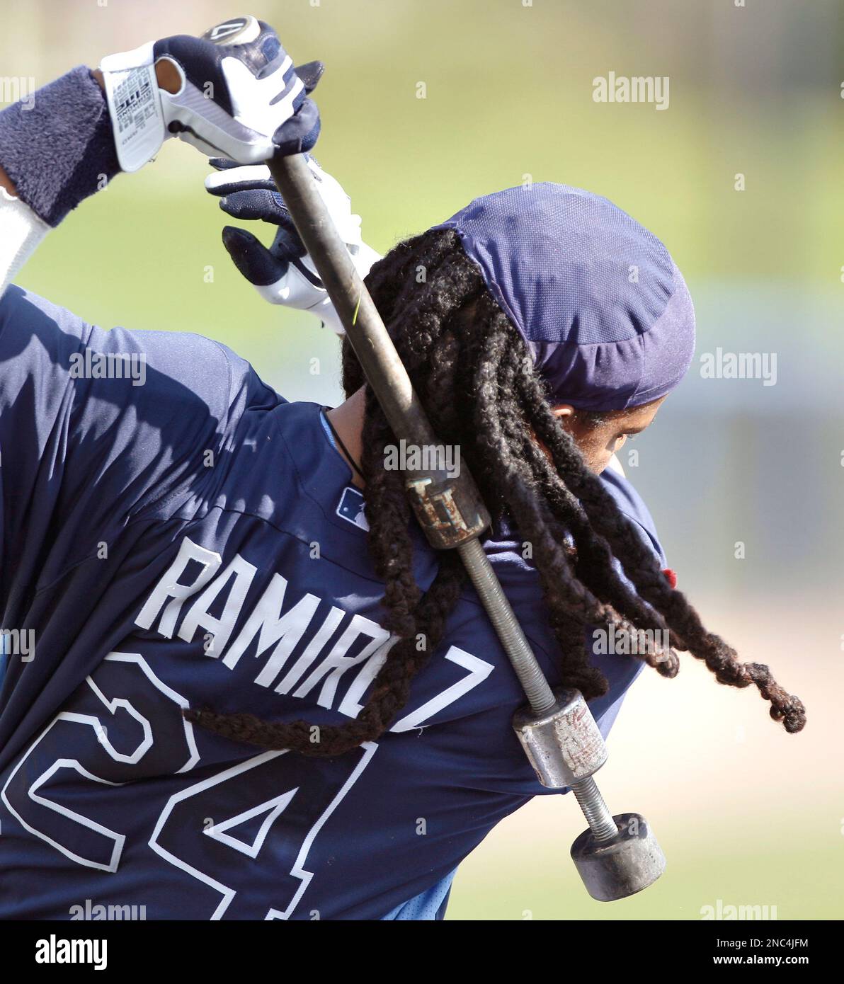 Tampa Bay Rays' Manny Ramirez warms up with a weighted metal bat during ...