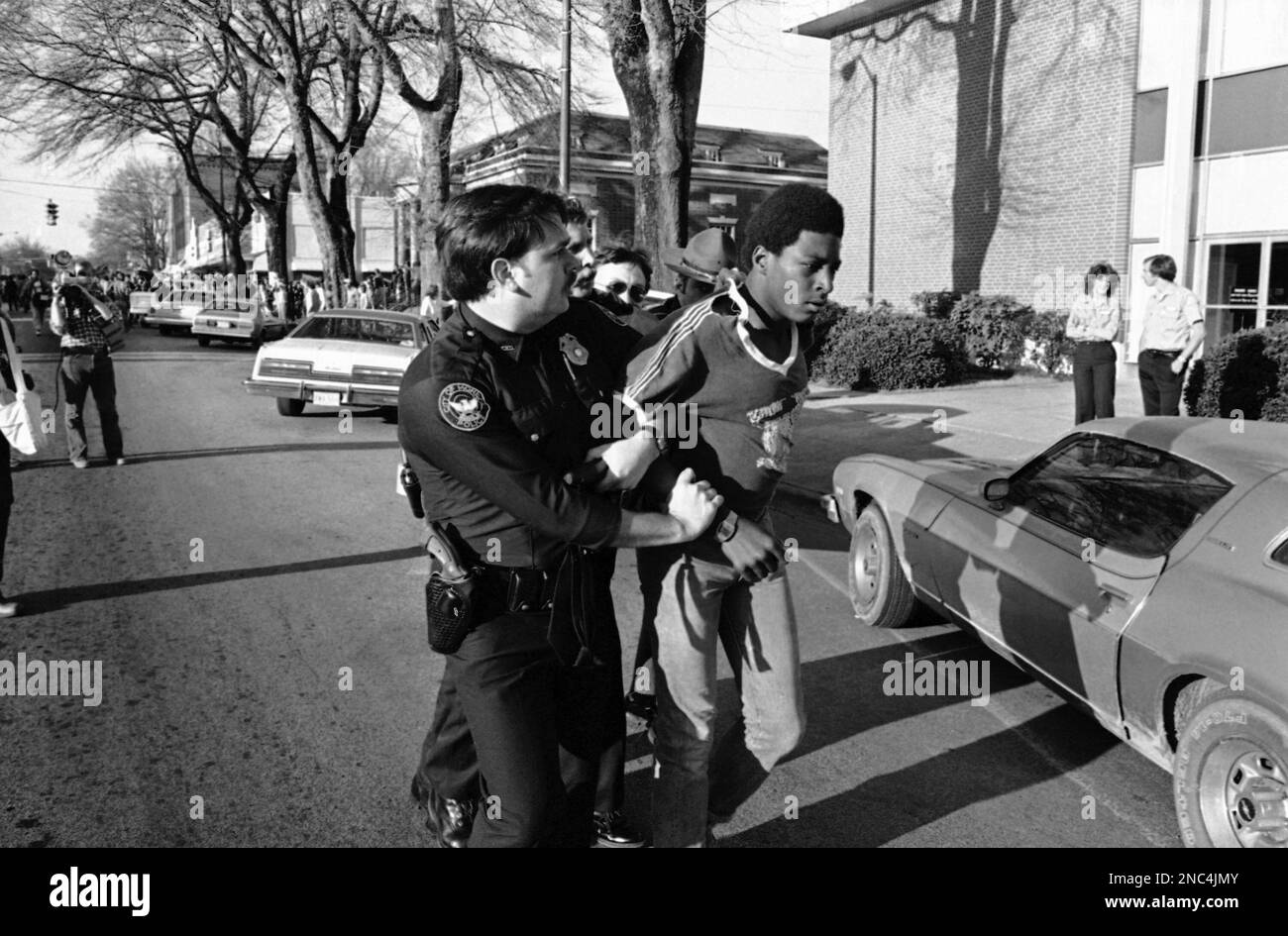 Police officer holding protestor social issues hi-res stock photography ...