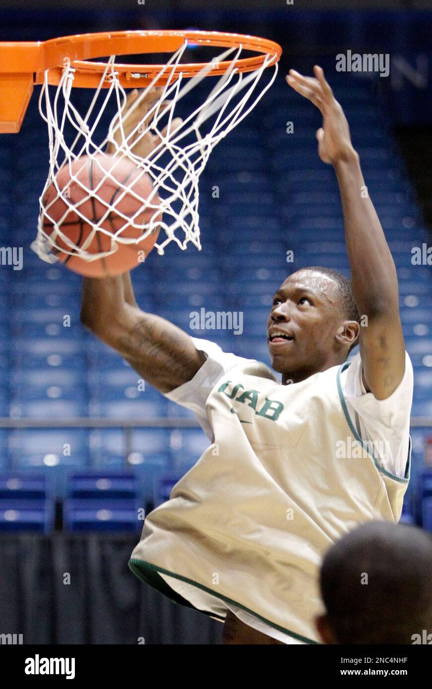 UAB forward Cameron Moore dunks during practice Monday, March 14, 2011 ...