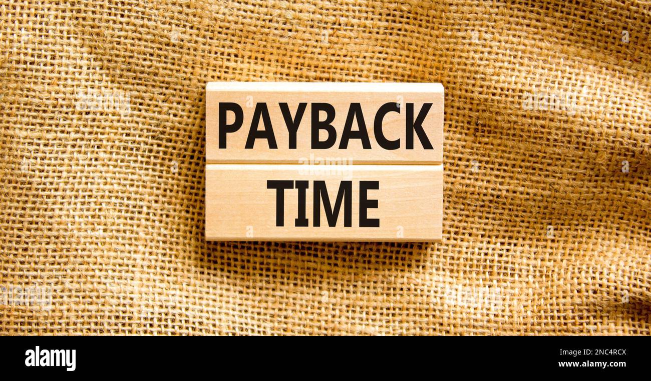 Payback time symbol. Concept words Payback time on wooden blocks ...