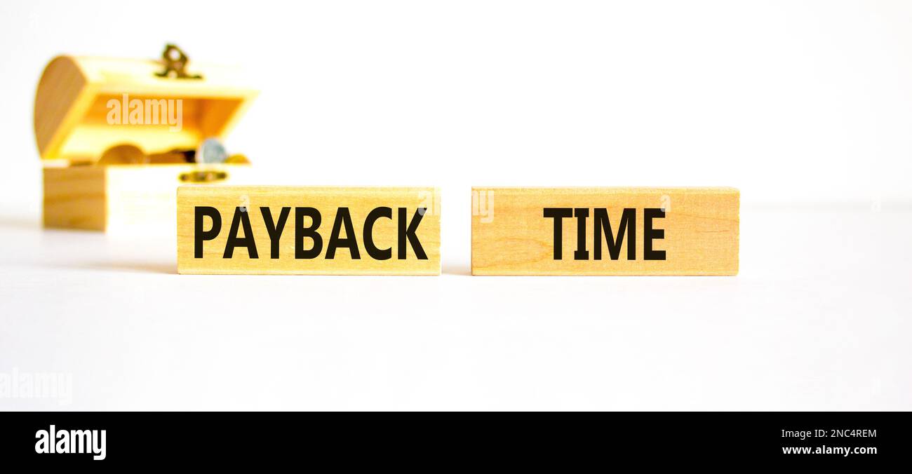 Payback time symbol. Concept words Payback time on wooden blocks ...