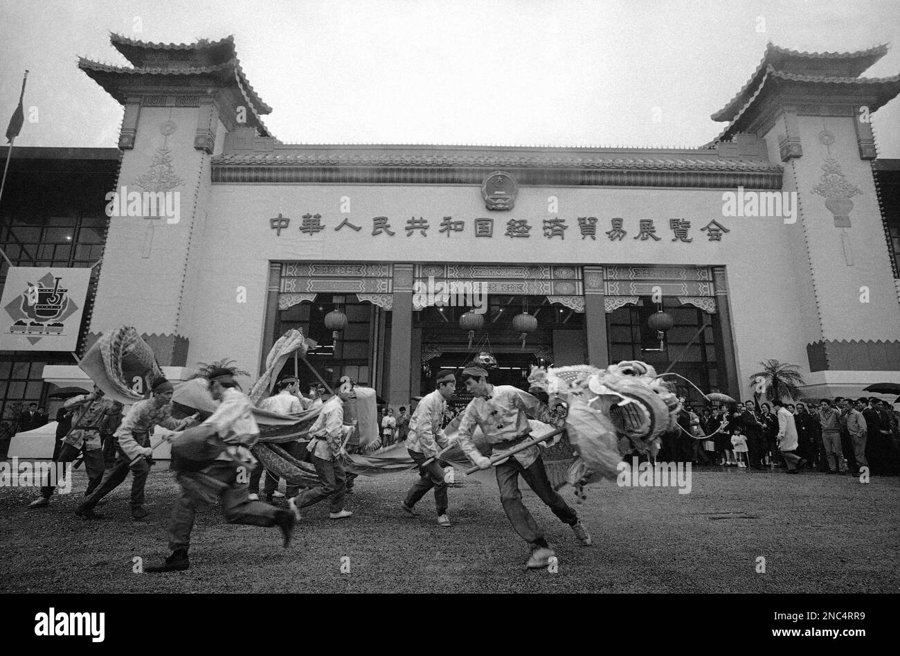 Traditional Chinese dragon dance is performed in front of the pavilion ...