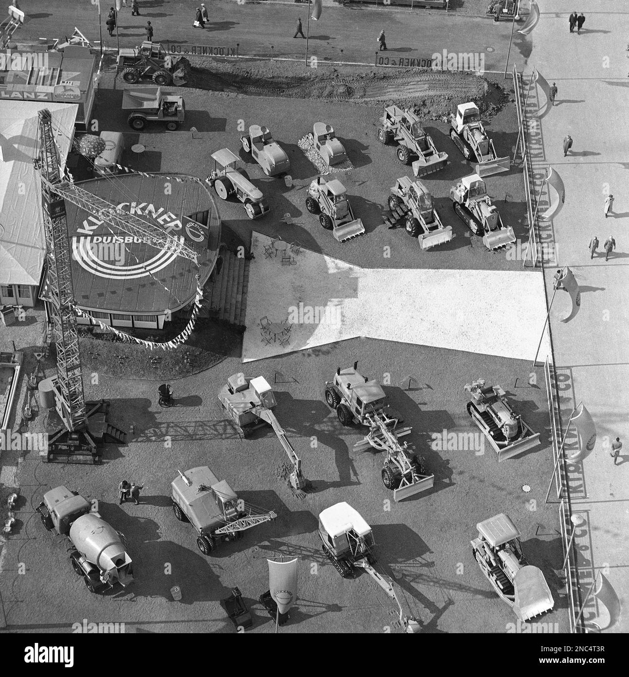 From the air, these cranes and other earth movers appear diminutive in ...