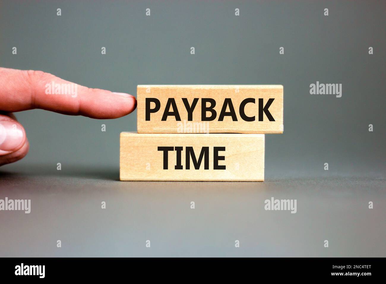 Payback time symbol. Concept words Payback time on wooden blocks ...