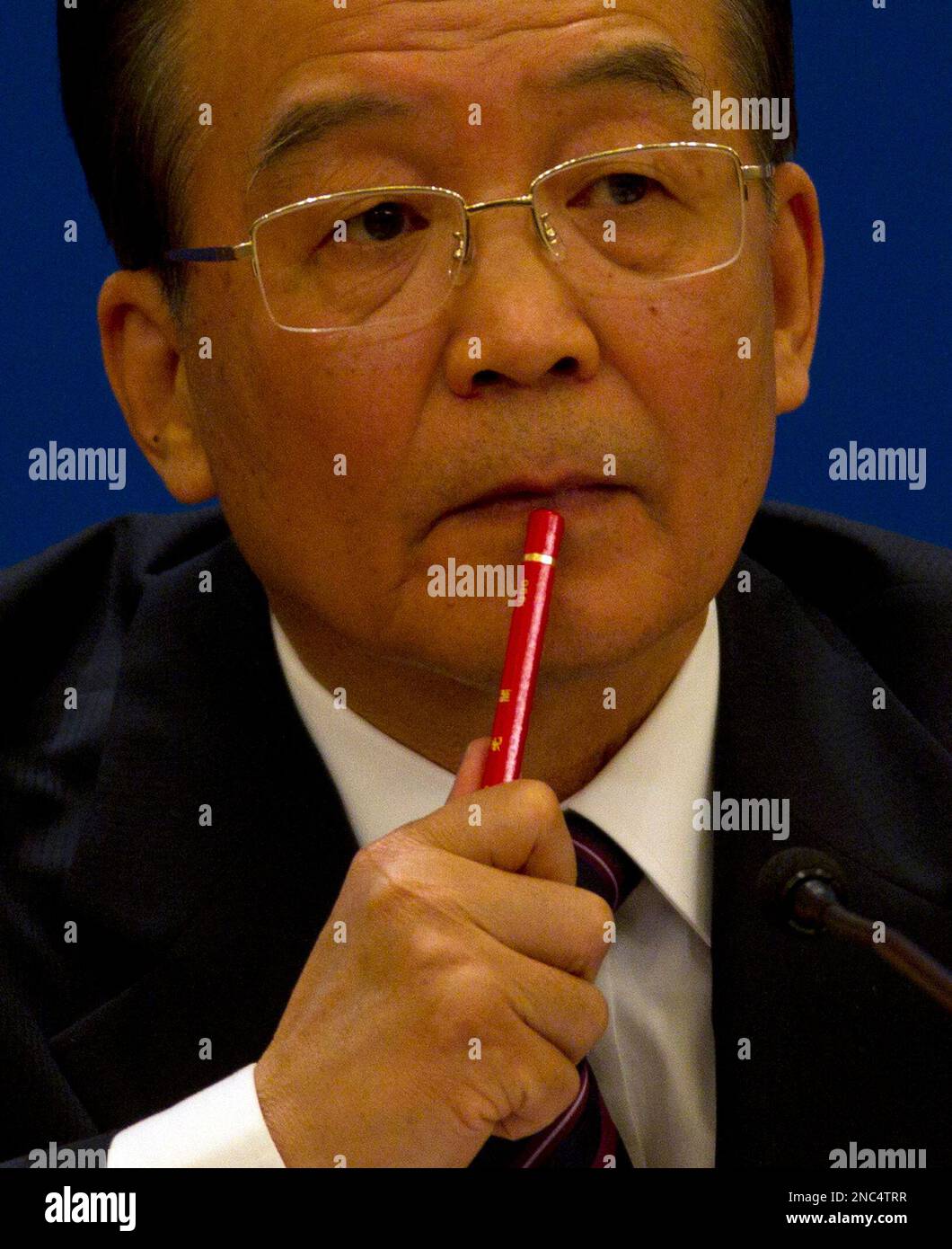 Chinese Premier Wen Jiabao listens to questions during a press ...