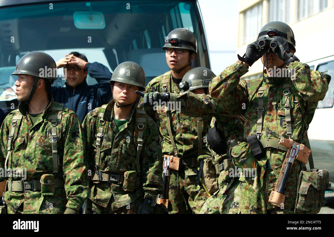 Japan Ground Self-Defense Force soldiers watch the sea from higher ...
