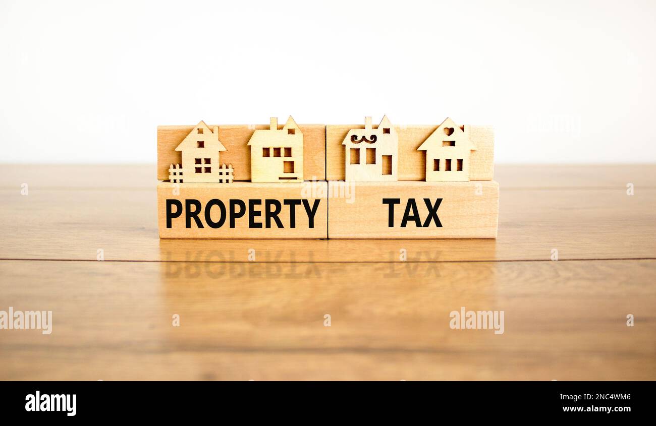 Property tax symbol. Concept words Property tax on wooden blocks ...