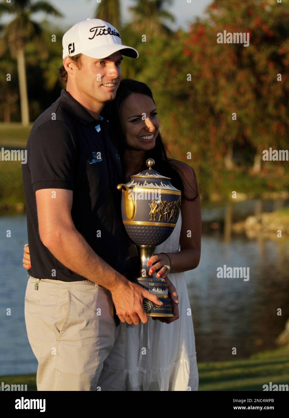 Nick Watney and his wife, Amber, pose with the trophy after he won the ...