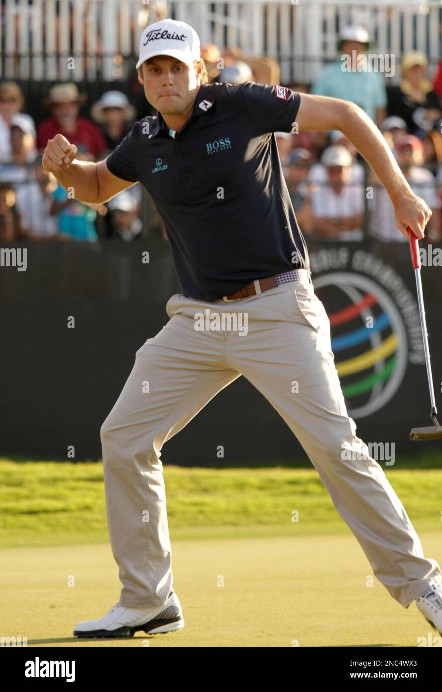 Nick Watney celebrates making a birdie putt on the 18th hole the ...