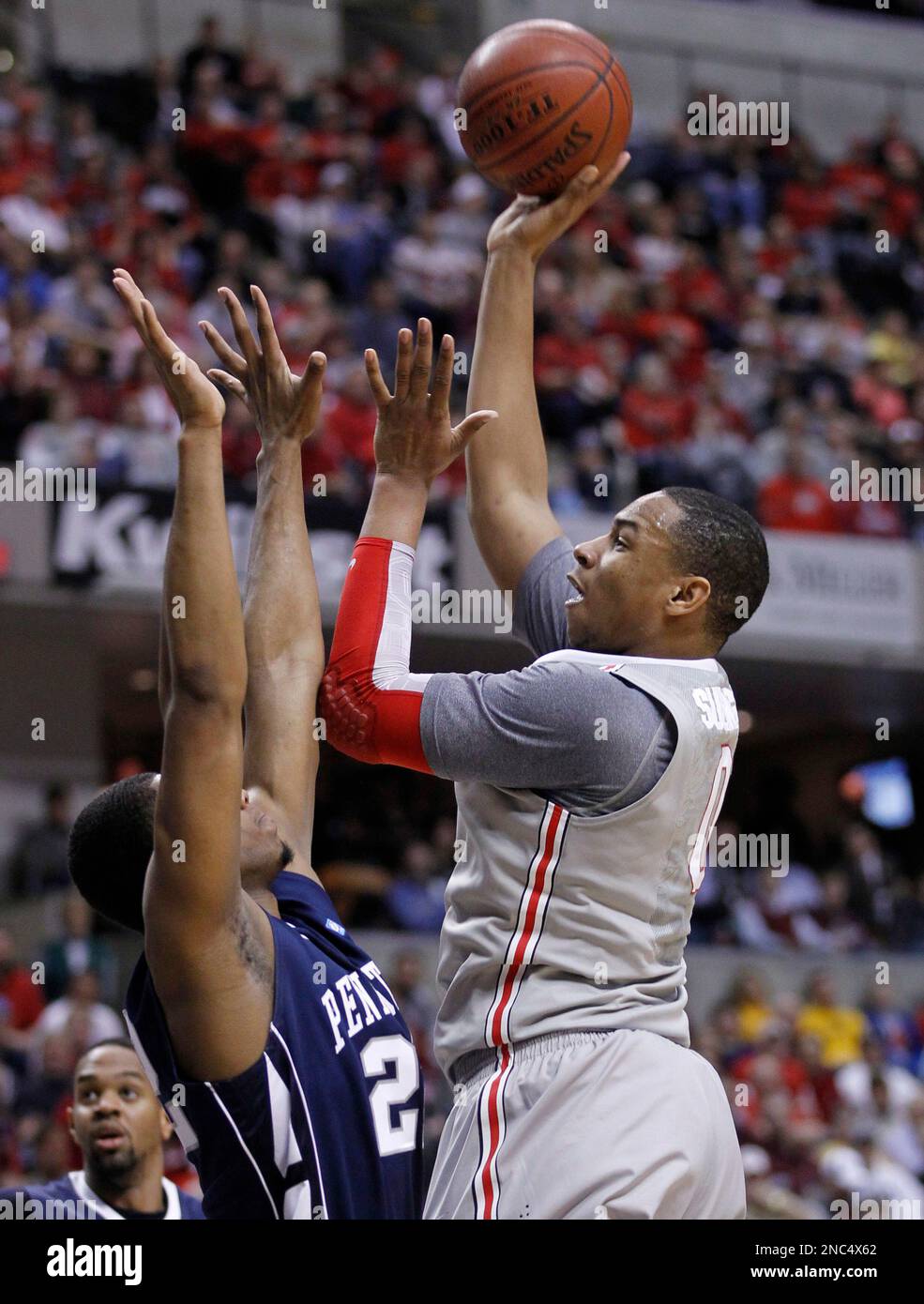 Ohio State forward Jared Sullinger, right, shoots over Penn State guard ...