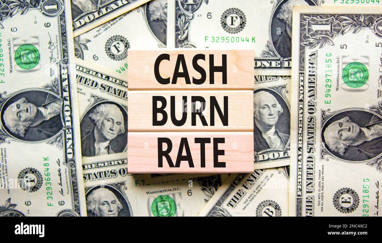 Cash burn rate symbol. Concept words Cash burn rate on wooden blocks on ...
