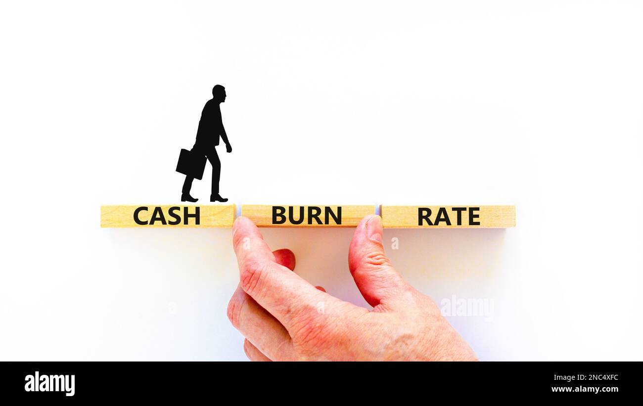 Cash burn rate symbol. Concept words Cash burn rate on wooden blocks on ...