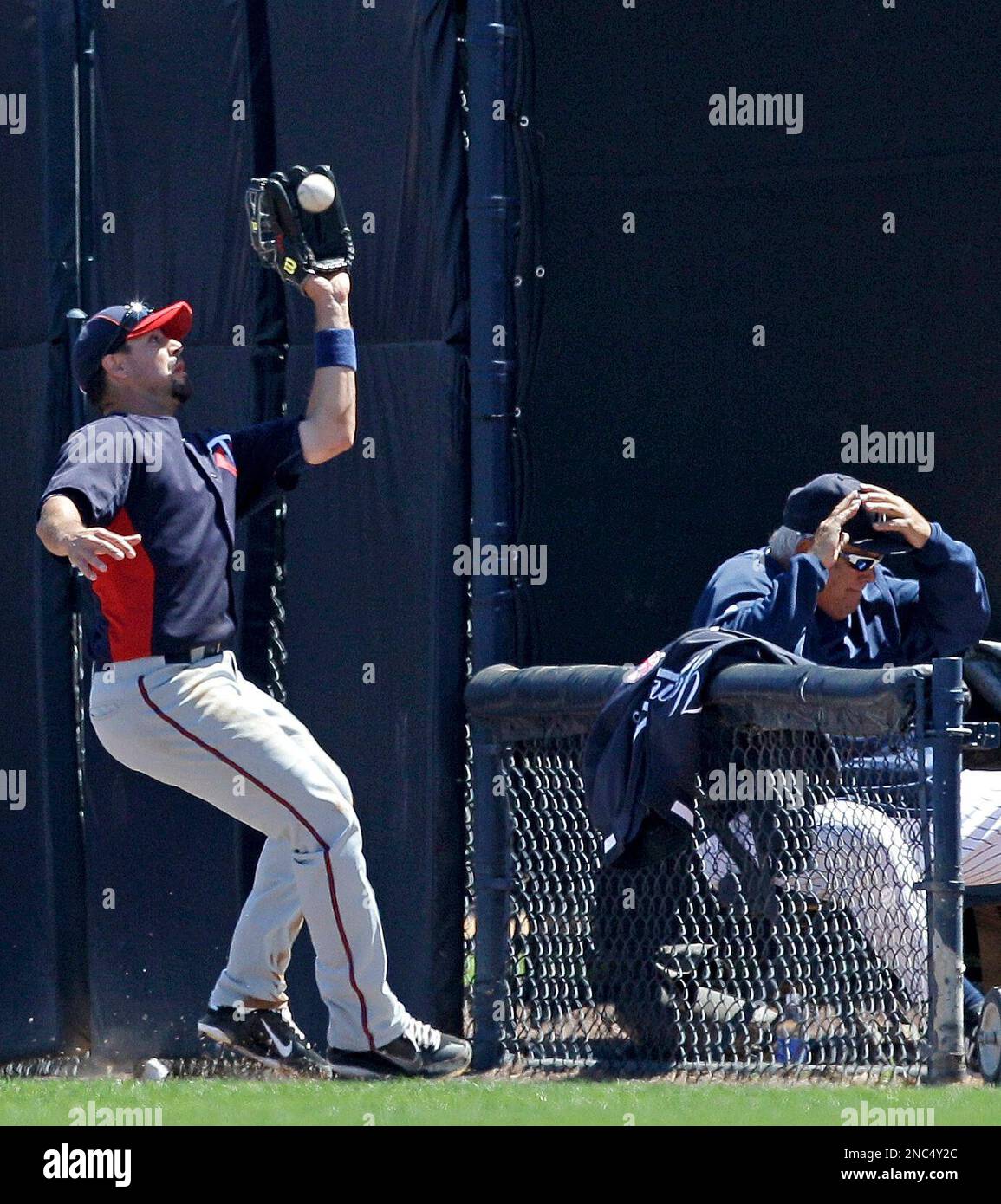 Minnesota Twins right fielder Jason Repko catches a fly ball by New ...