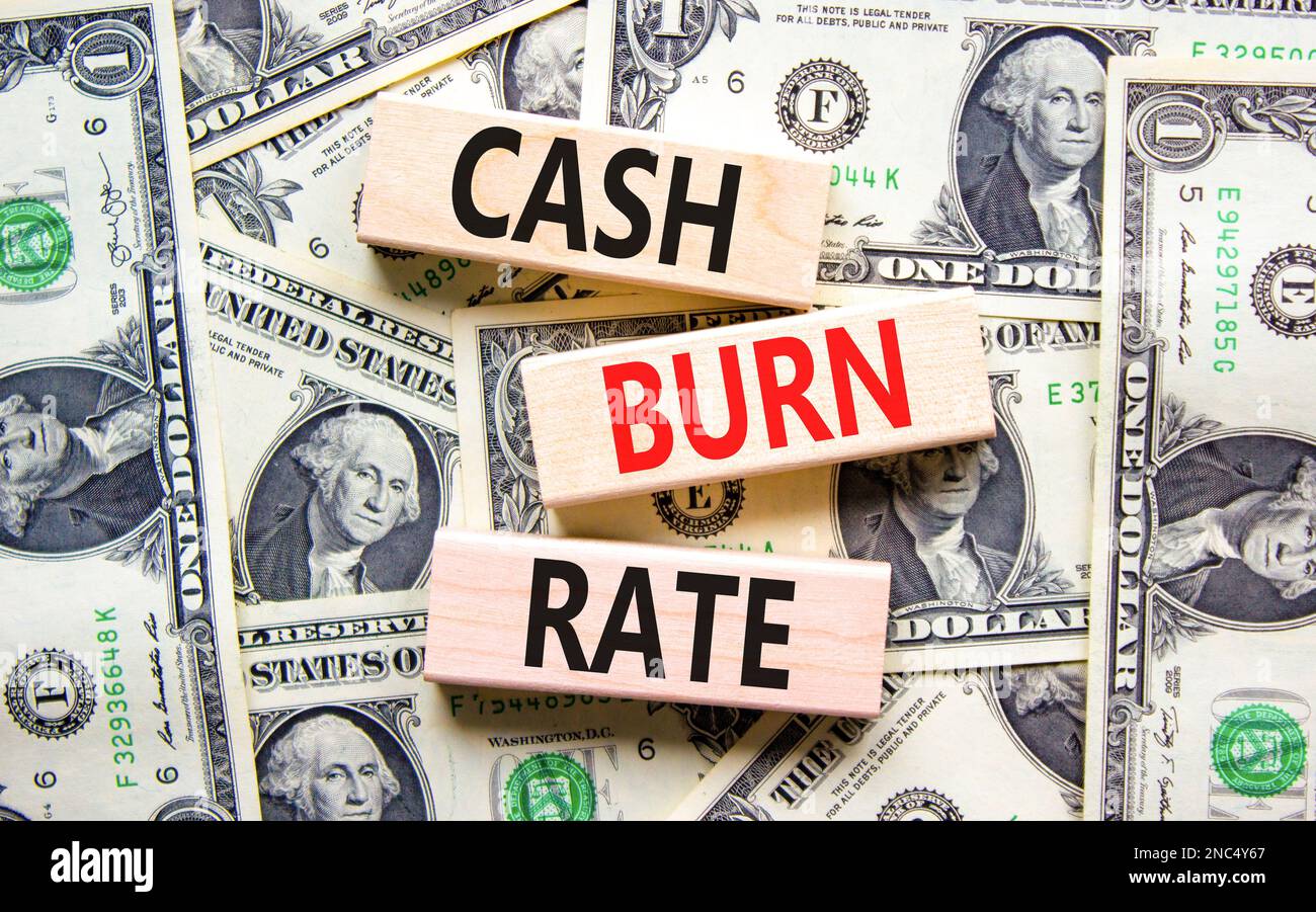 Cash burn rate symbol. Concept words Cash burn rate on wooden blocks on ...