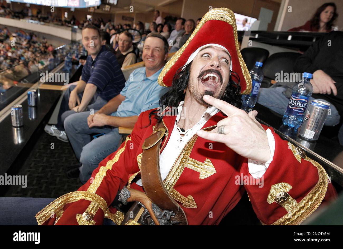 Captain Morgan pose for a fan during an NBA game at the American ...
