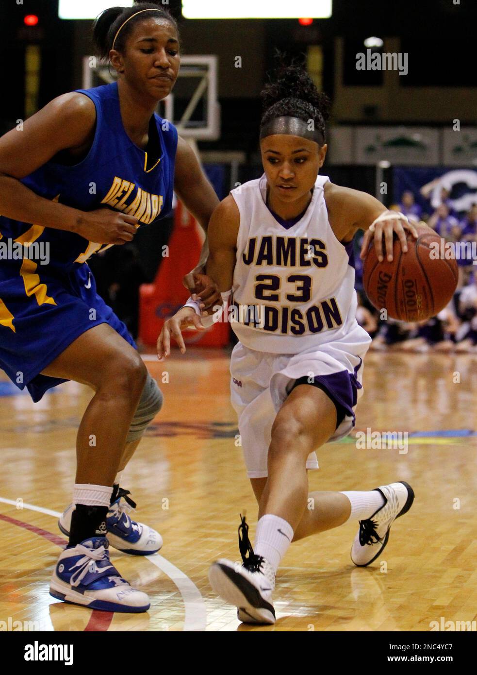 James Madison guard Dawn Evans (23) drives against Delaware forward ...