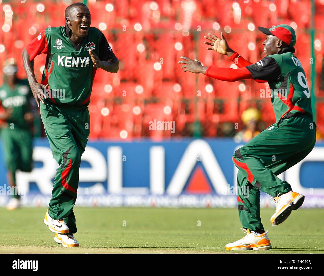 Kenya's cricket captain Jimmy Kamande, left, celebrates after taking ...