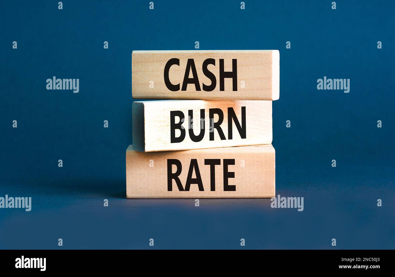 Cash burn rate symbol. Concept words Cash burn rate on wooden blocks on ...