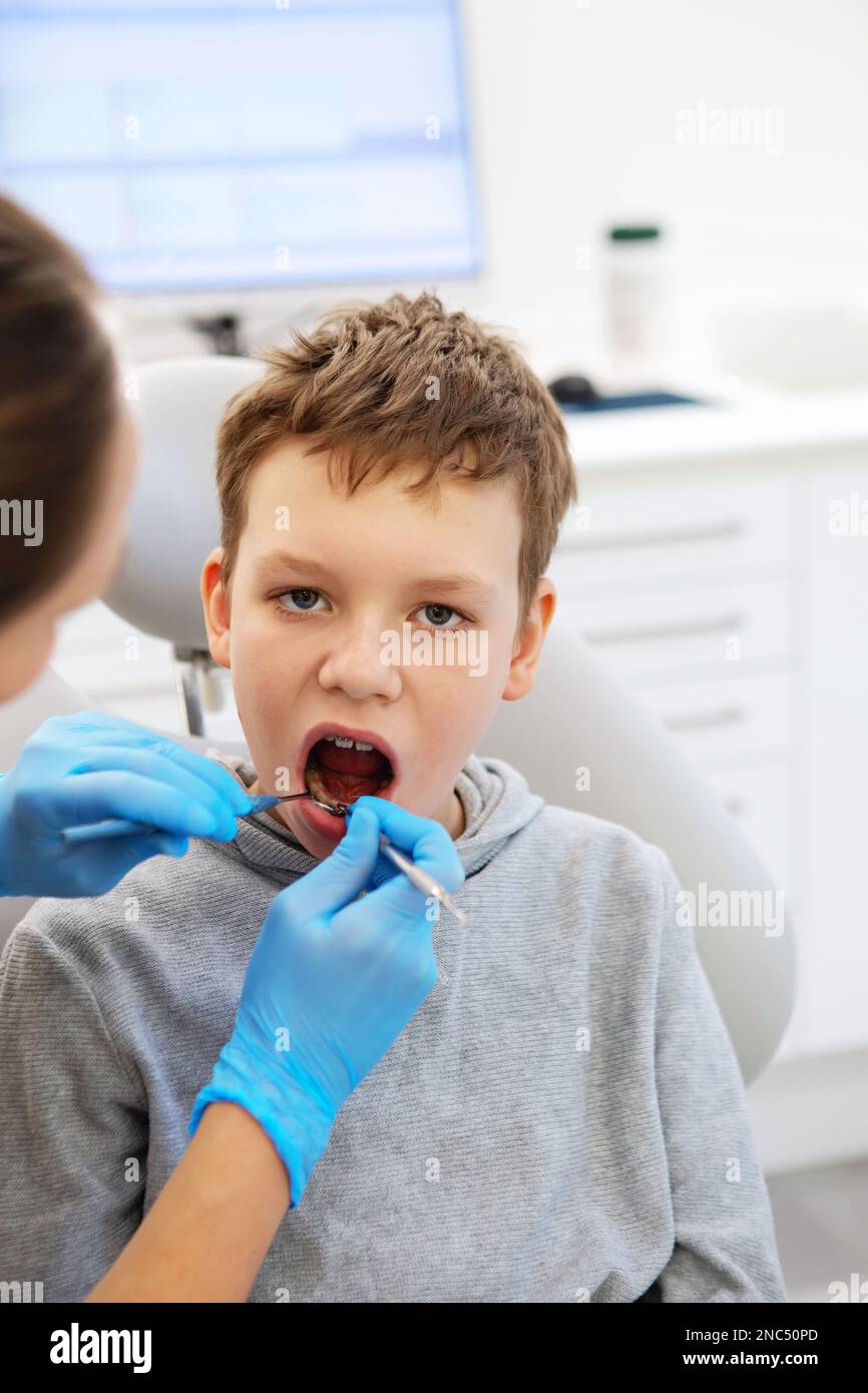 Boy flossing teeth hi-res stock photography and images - Alamy