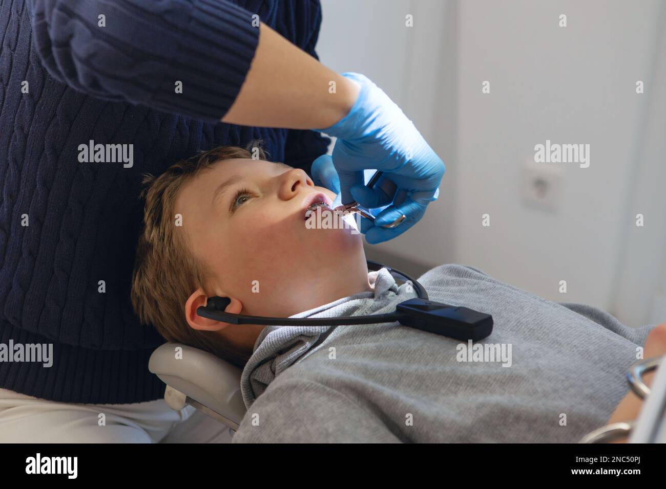 Kid in a dental clinic. Orthodontic treatment. Children's dentistry ...