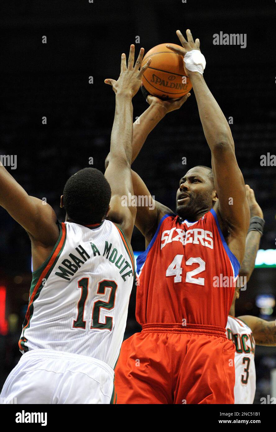 Milwaukee Bucks' Luc Richard Mbah a Moute (12), left, tries to block ...