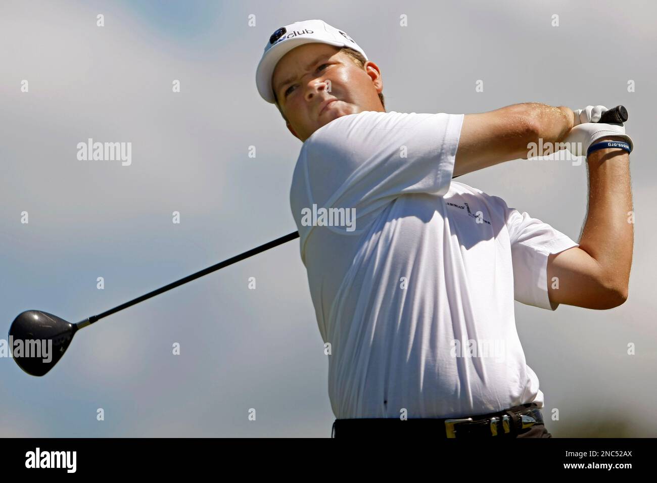 Hunter Haas of the United States watches his drive from the 15th hole ...