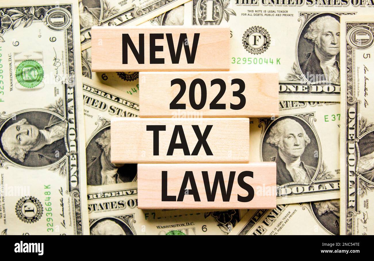 New 2023 tax laws symbol. Concept words New 2023 tax laws on wooden ...