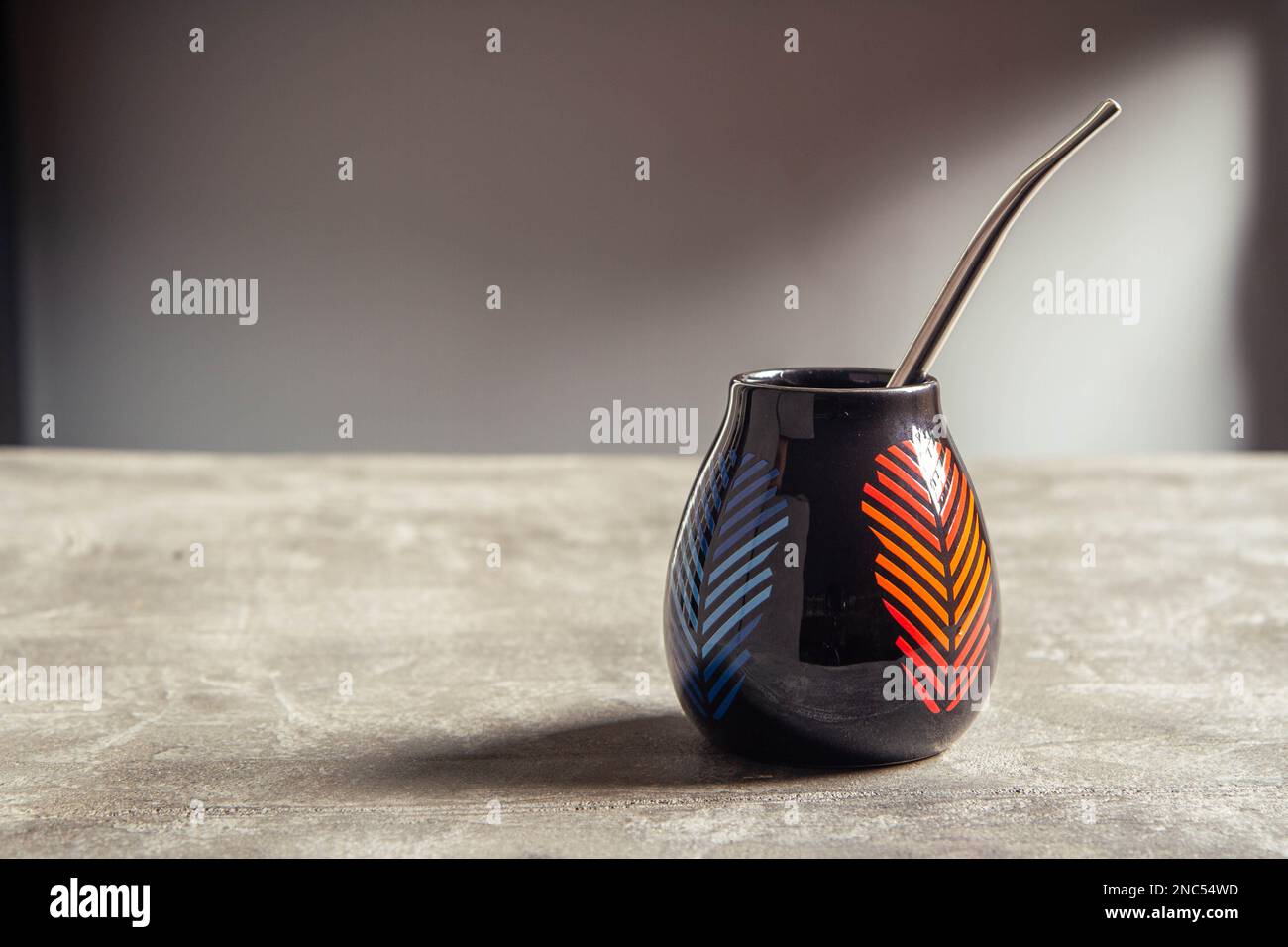 pretty shiny ceramic yerba mate cup, with orange and blue leaf design ...